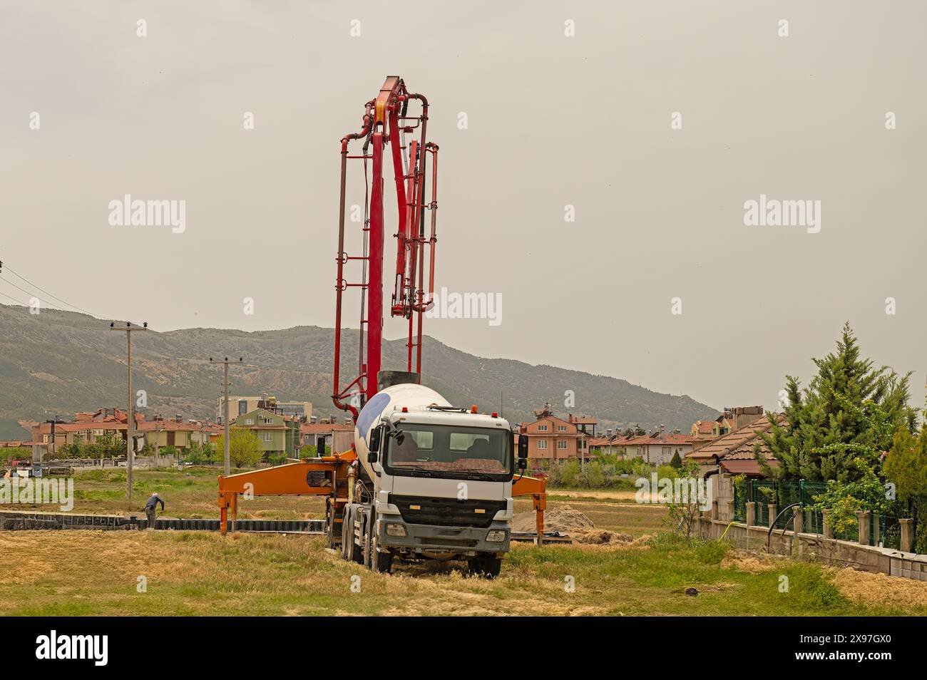 Concrete pump at construction site. Concrete pouring with pump ...