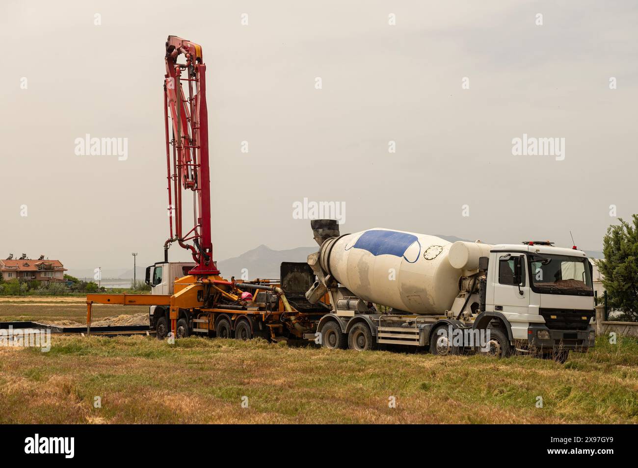 Concrete pump at construction site. Concrete pouring with pump ...