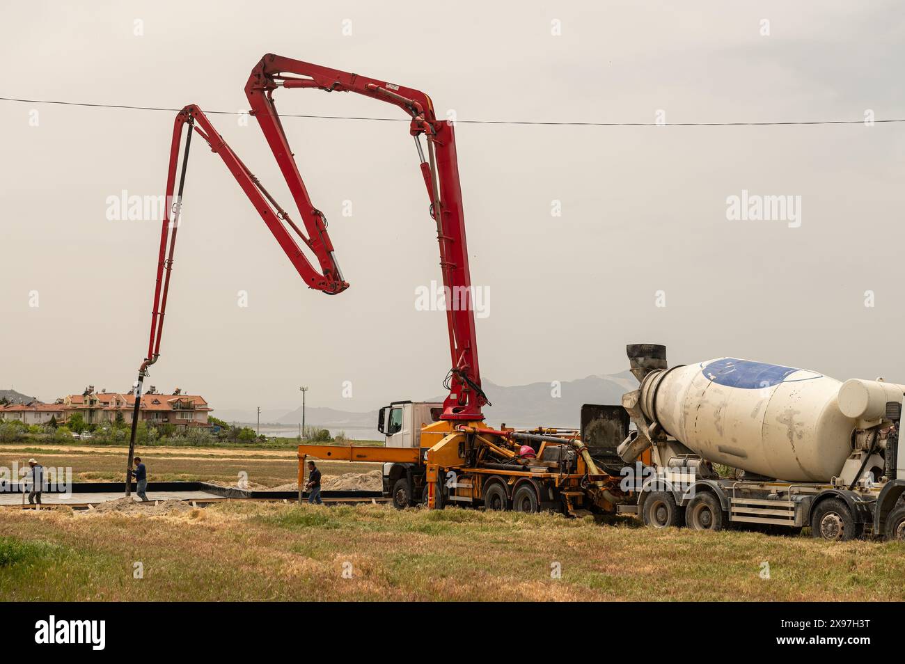 Concrete pump at construction site. Concrete pouring with pump ...