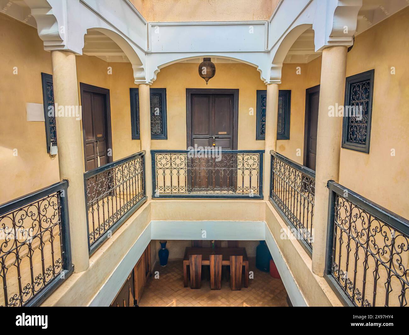 Interior of a typical Moroccan riad with a small pool in the middle of ...