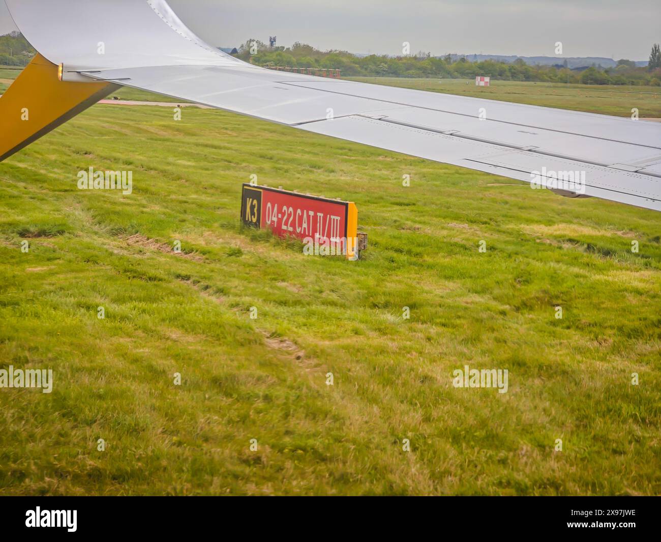 Distance signs in the airport. View from a plane of a runway Stock ...