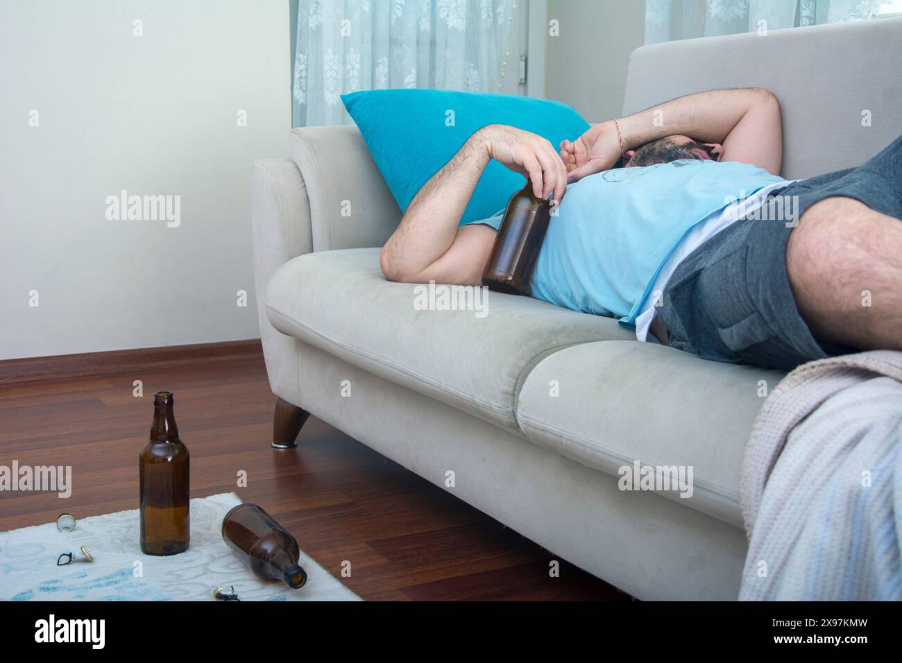 Man who fainted from alcohol sleeps with an alcohol bottle even while ...