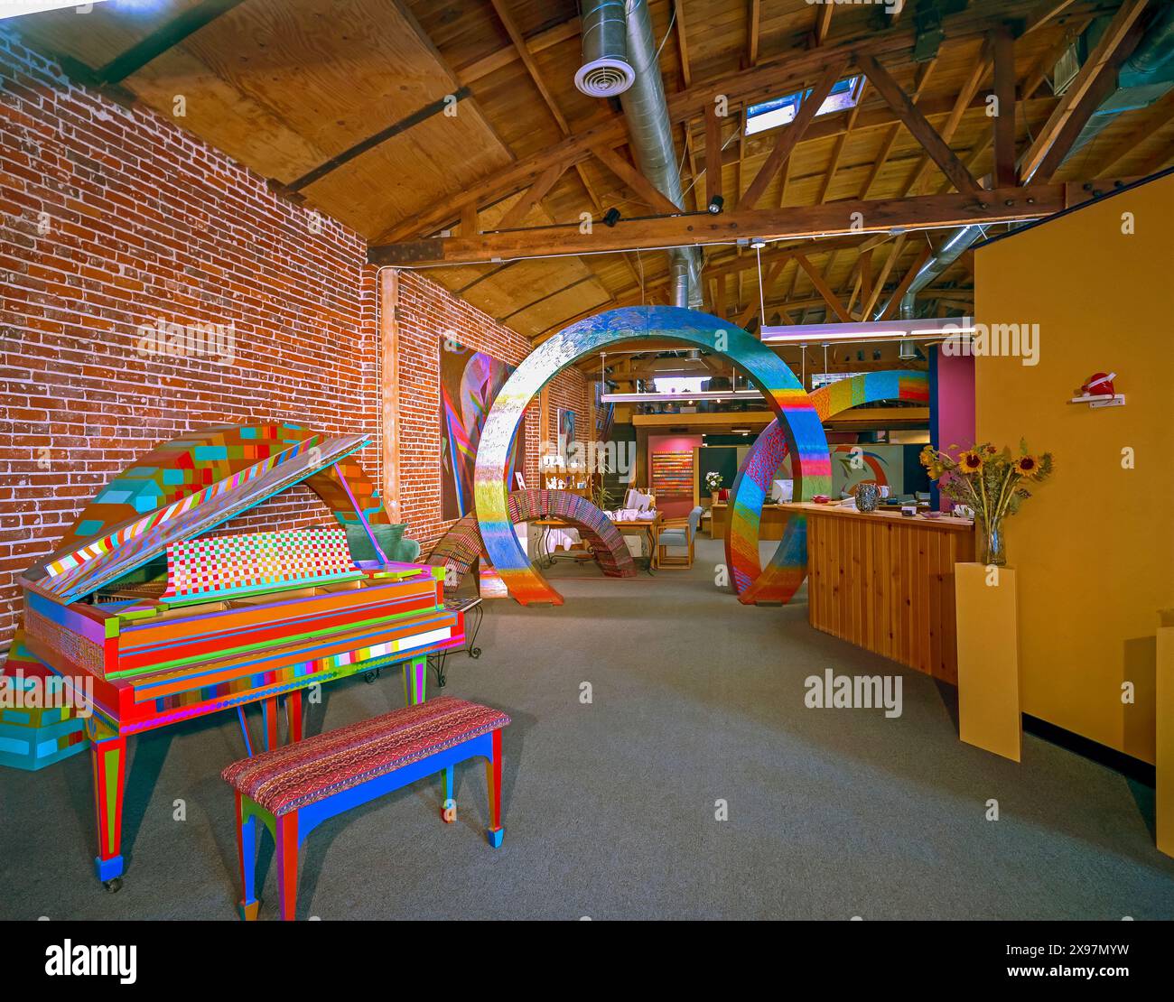 A colorful commercial interior space using art, and unusual shapes ...