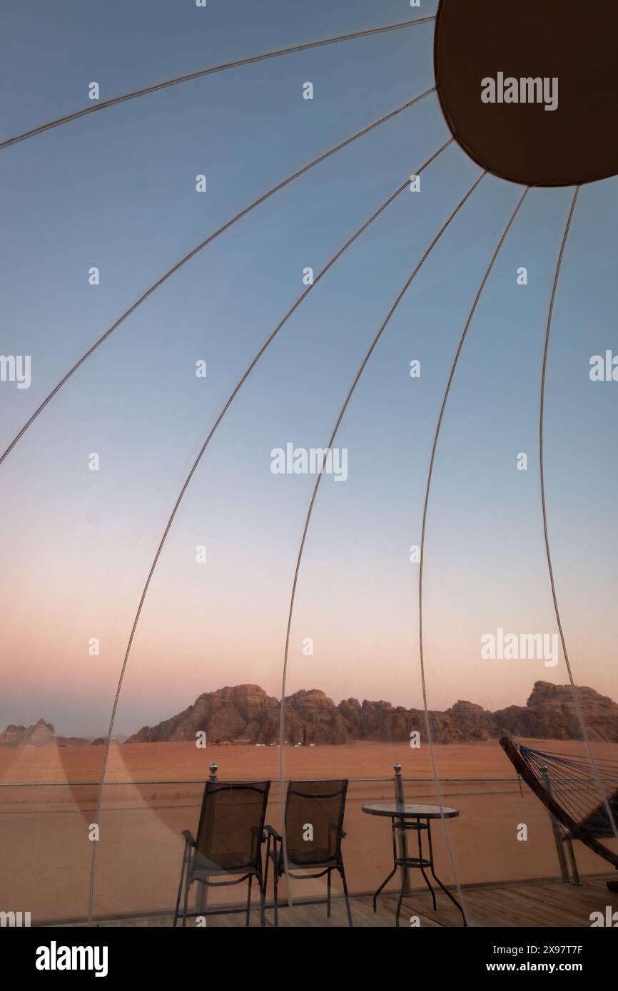 Sunrise at Wadi Rum desert seen trough the dome of a bubble tent Stock ...