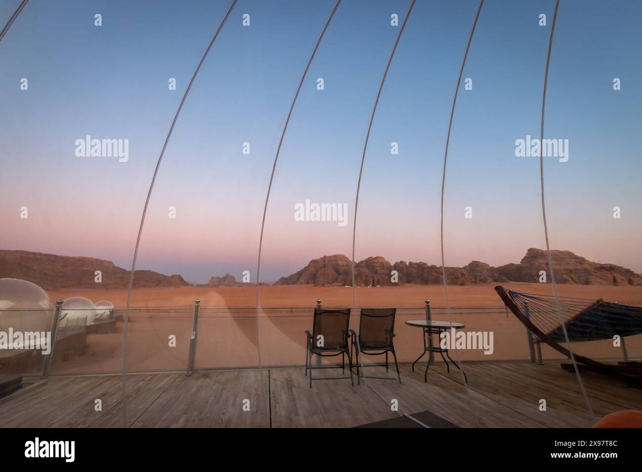 Sunrise at Wadi Rum desert seen trough the dome of a bubble tent Stock ...