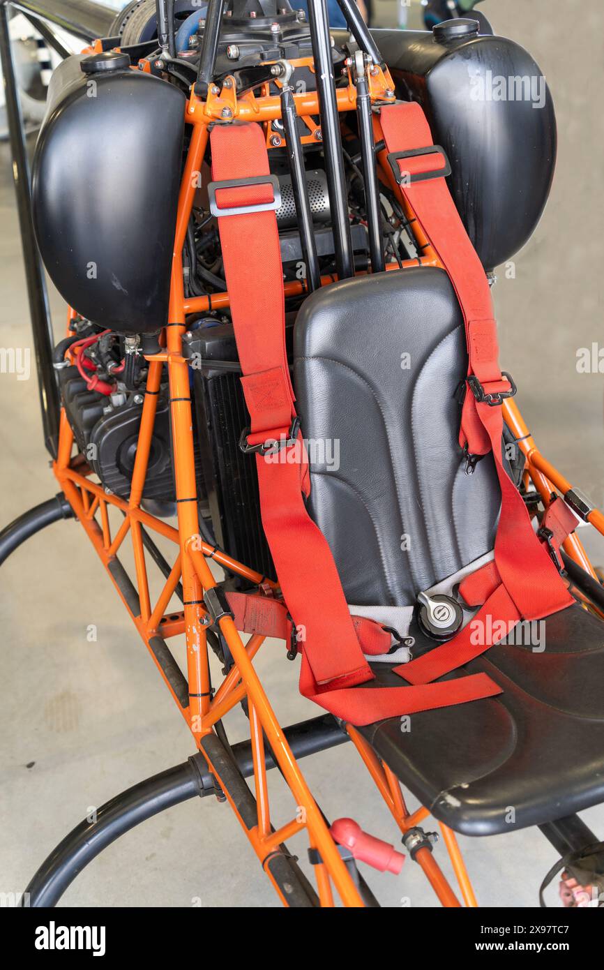 Small gyrocopter pilot's seat with safety belt Stock Photo - Alamy