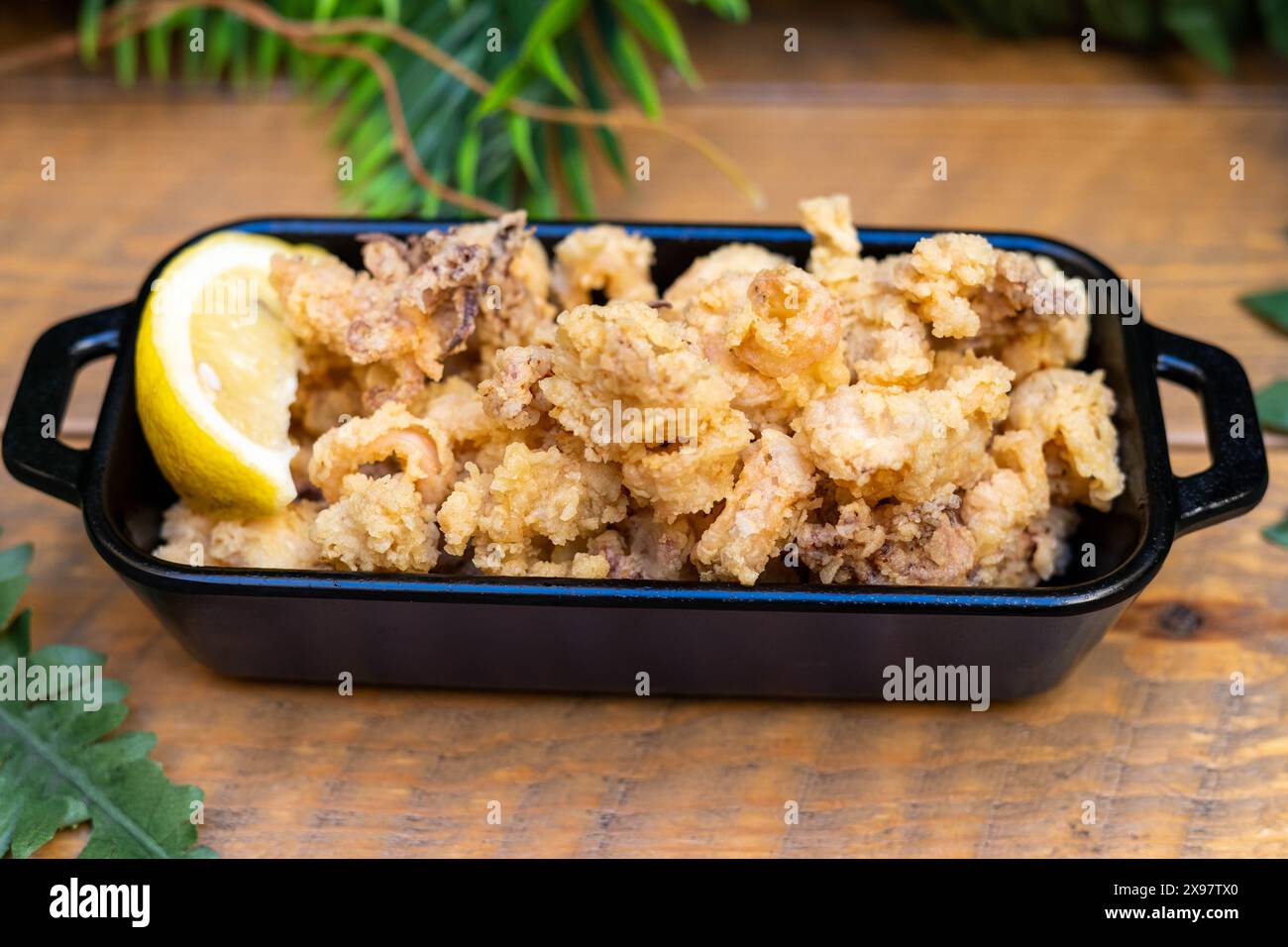 Typical Spanish portion of fried squid Stock Photo - Alamy
