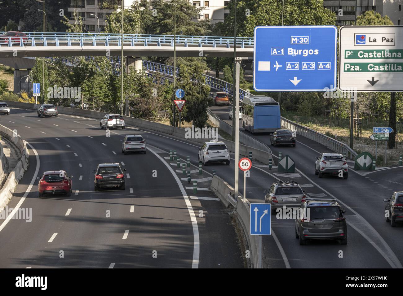 In organized traffic, vehicles traveling in opposite directions are ...