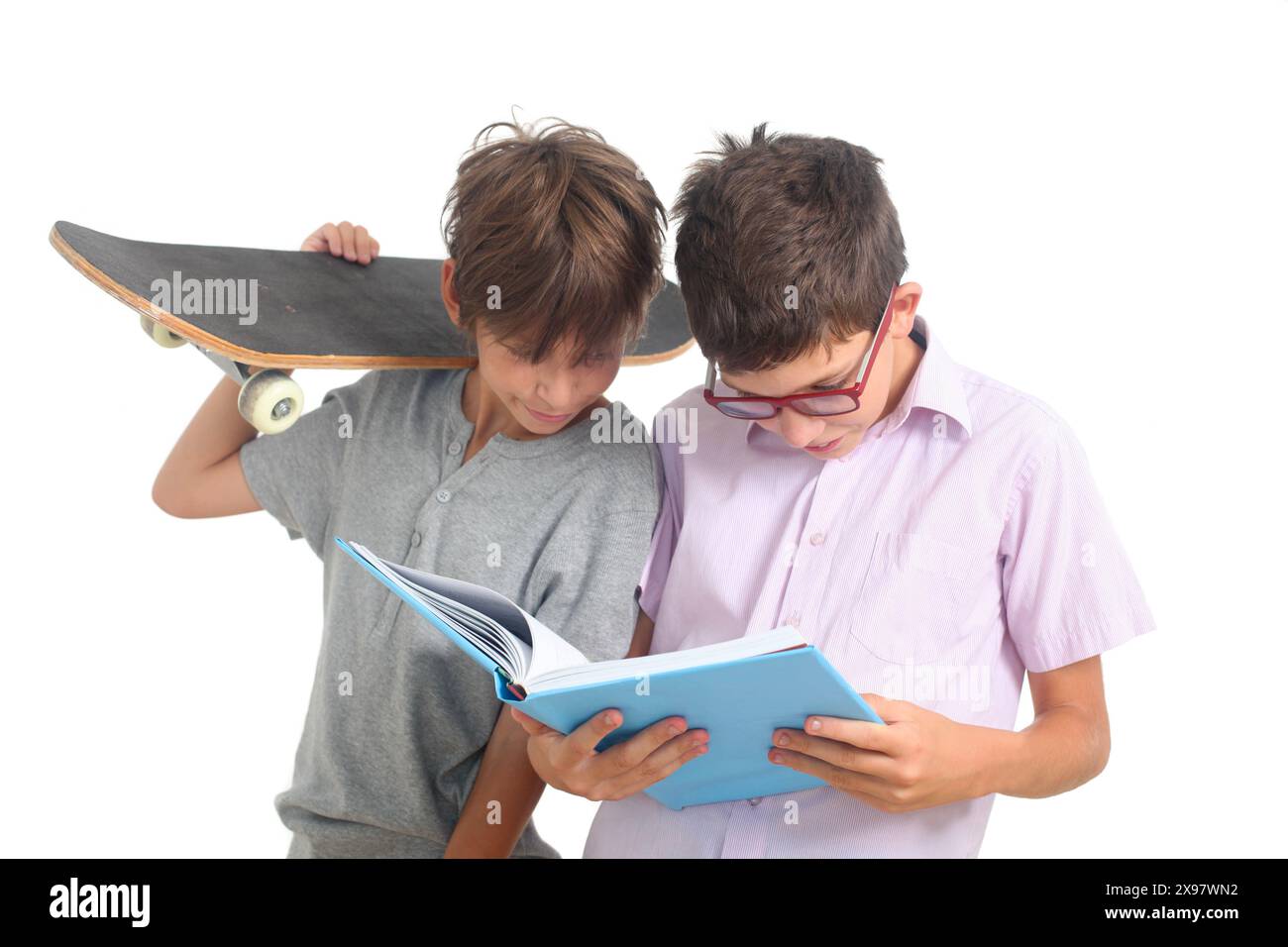 nerd with books and cool kid with skateboard on white background Stock ...