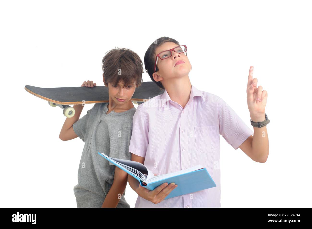 nerd with books and cool kid with skateboard on white background Stock ...