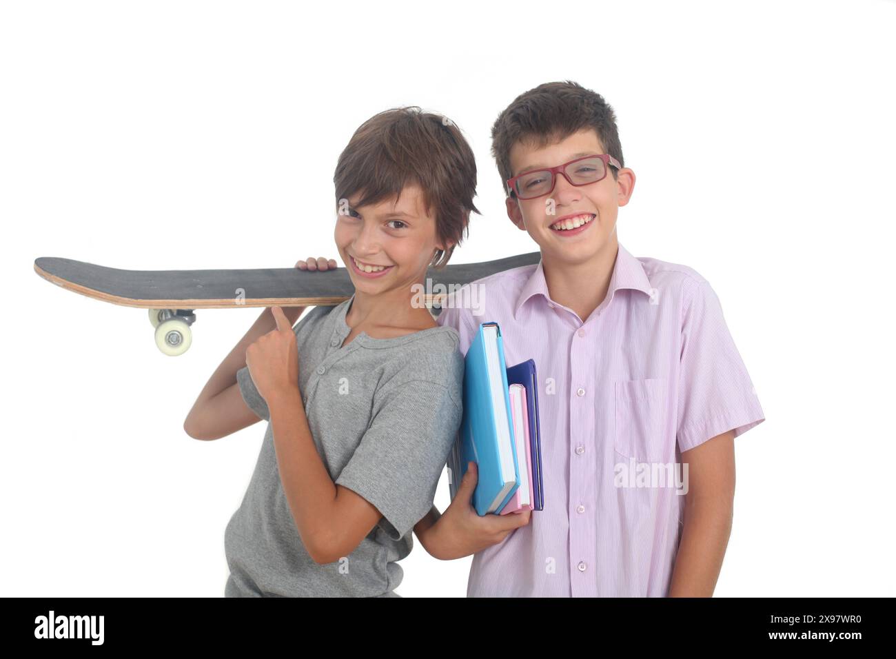 nerd with books and cool kid with skateboard on white background Stock ...