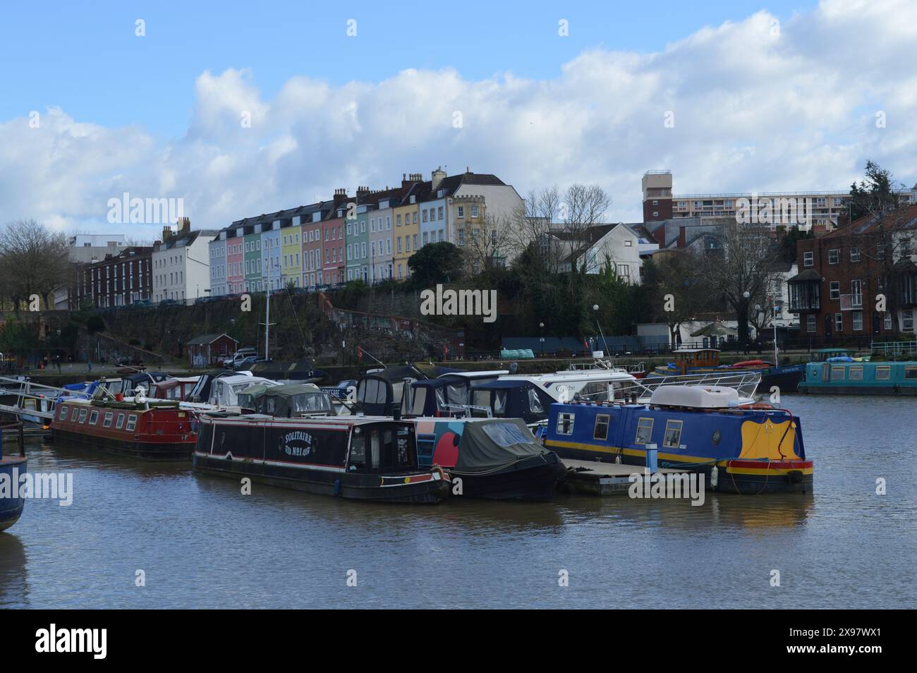 Colourful houses of Redcliffe Parade and Narrowboats of Bristol Harbour ...