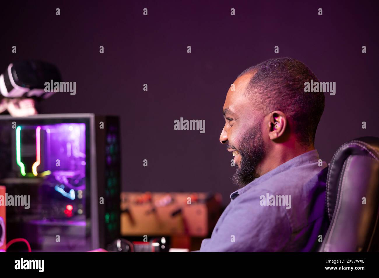 Gamer laughing at home, having fun playing videogames on computer ...