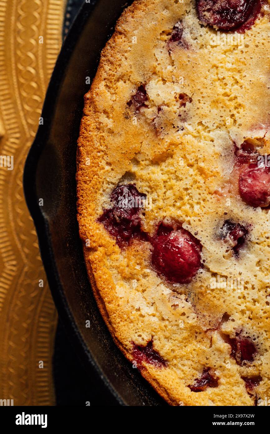 cherry clafoutis in cast iron skillet Stock Photo - Alamy
