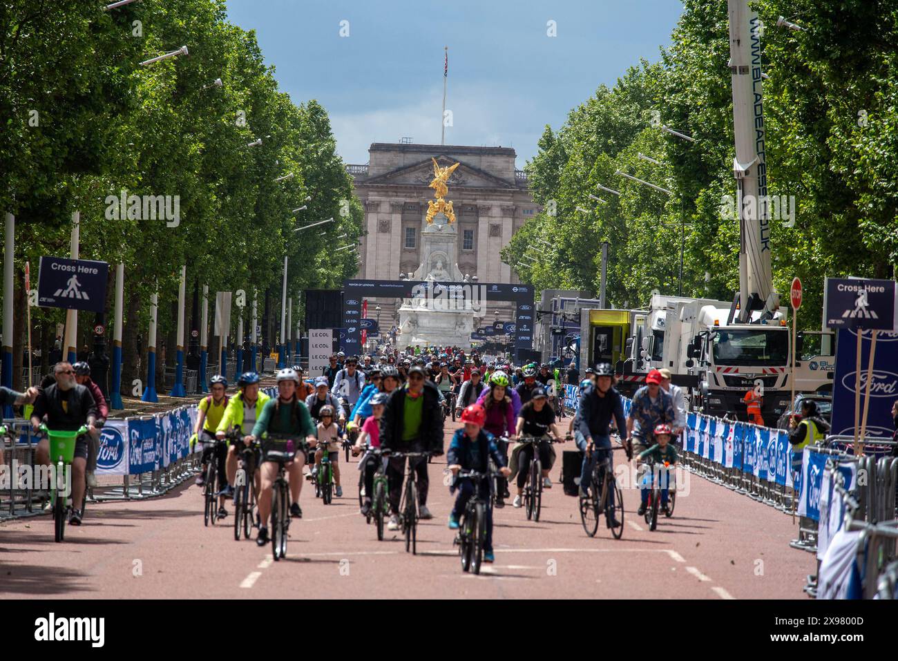 London, UK. 26th May, 2024. Cyclists ride through The Mall in London ...