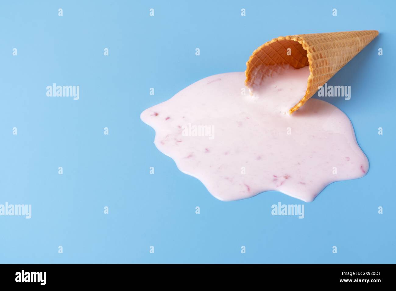 Pink ice cream melting and spilling from the waffle cone Stock Photo ...