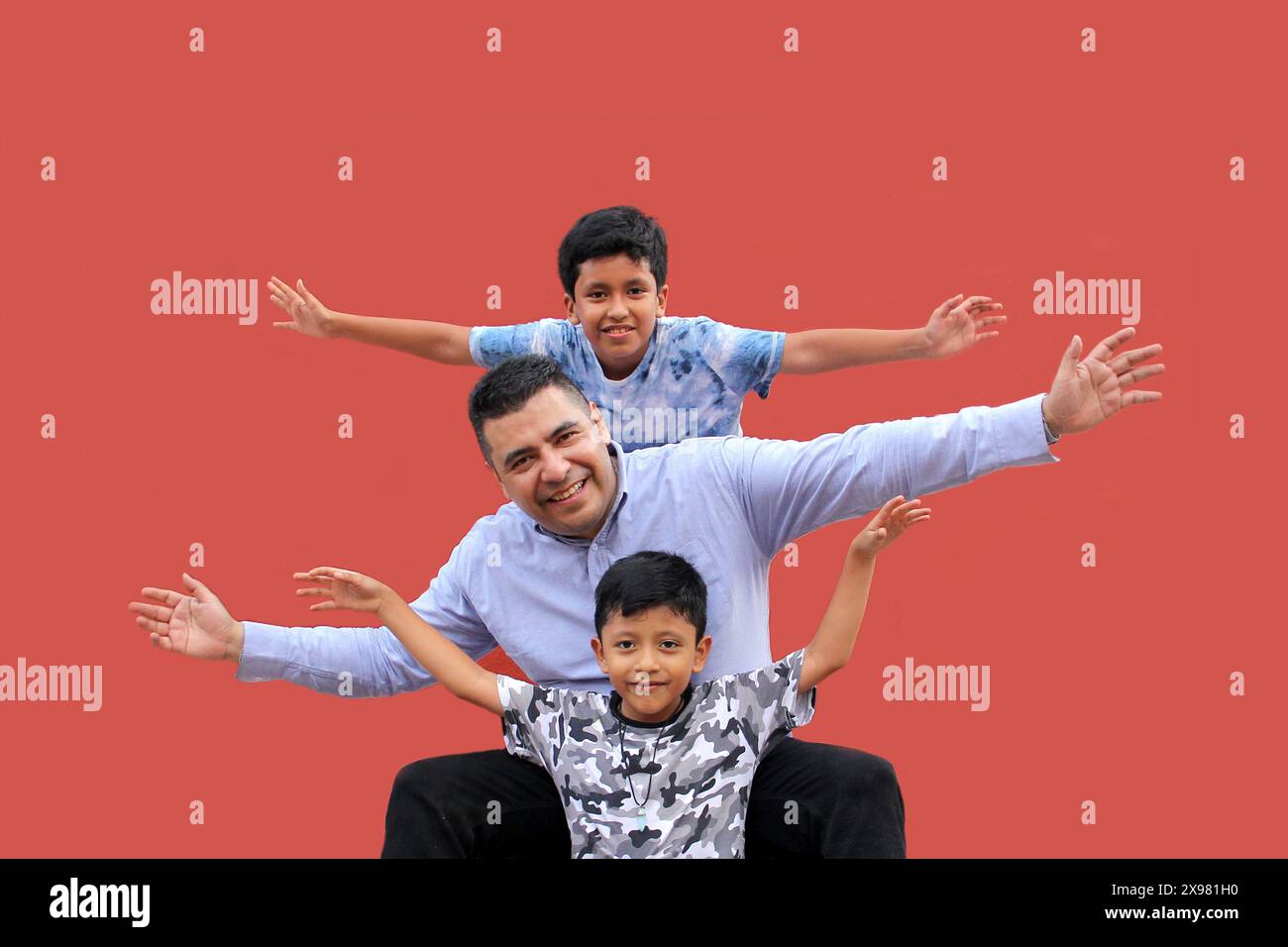 Divorced single dad plays with his two dark-skinned Latino children ...