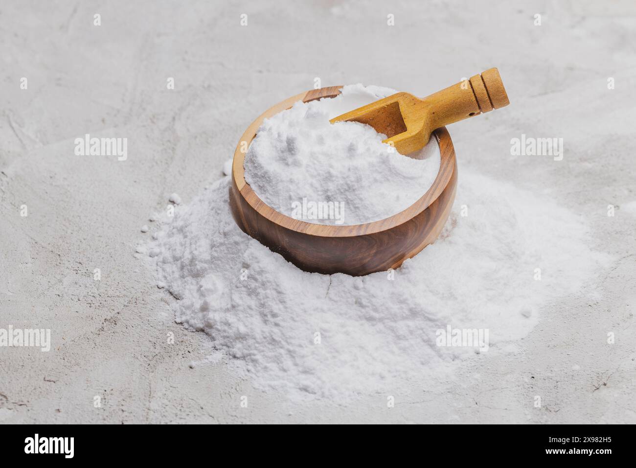 Baking soda in wooden container on rustic surface Stock Photo - Alamy