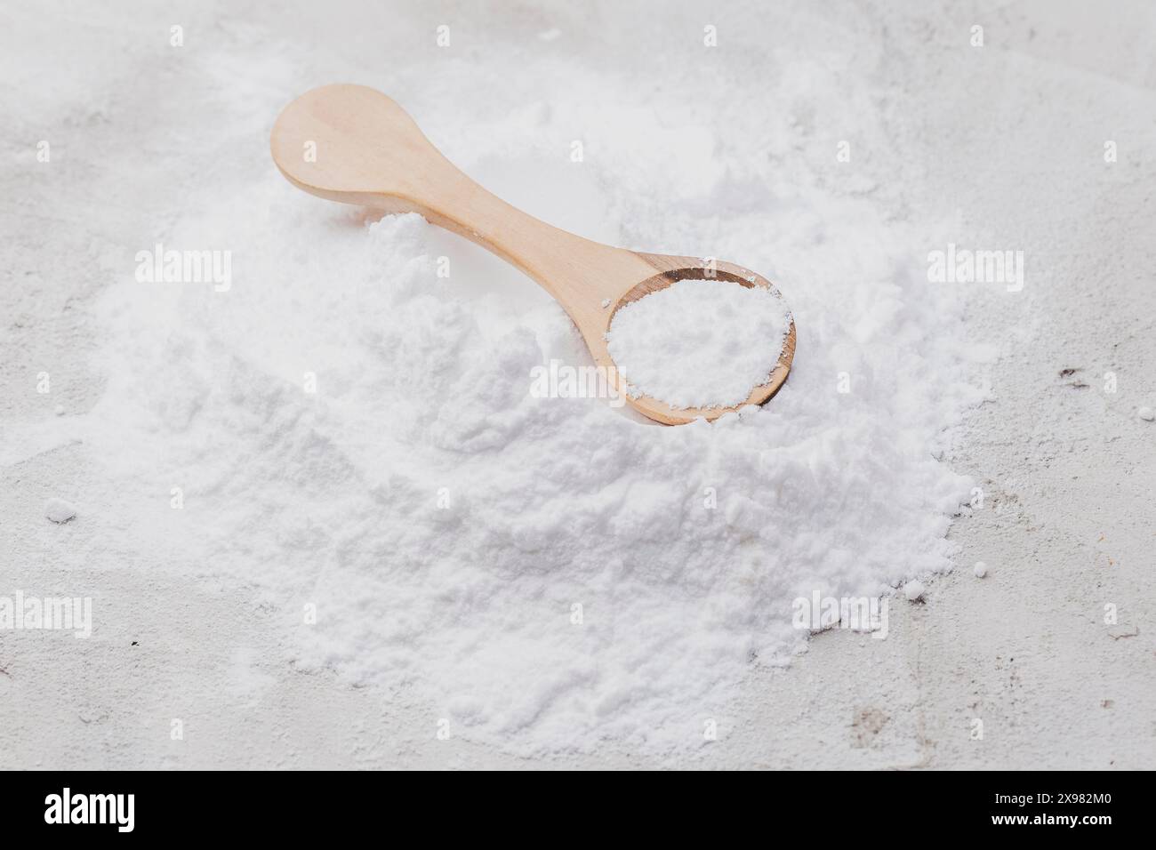 Baking soda in wooden container on rustic surface Stock Photo - Alamy