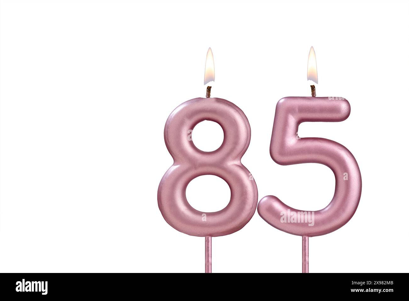 Candle number 85 - Lit birthday candle on white background Stock Photo ...