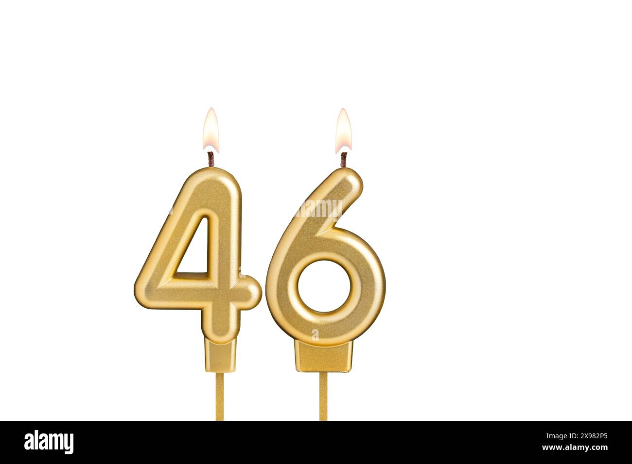 Golden number 46 birthday candle on white background Stock Photo - Alamy