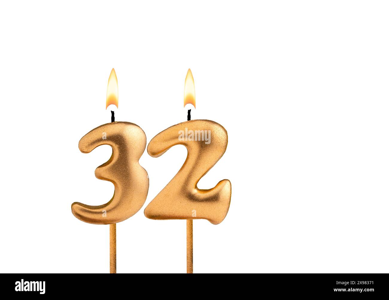 Birthday number 32 - Golden candle on white background Stock Photo - Alamy