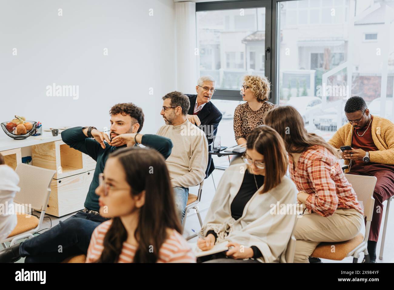 Multicultural, business coworkers collaborating in a meeting ...