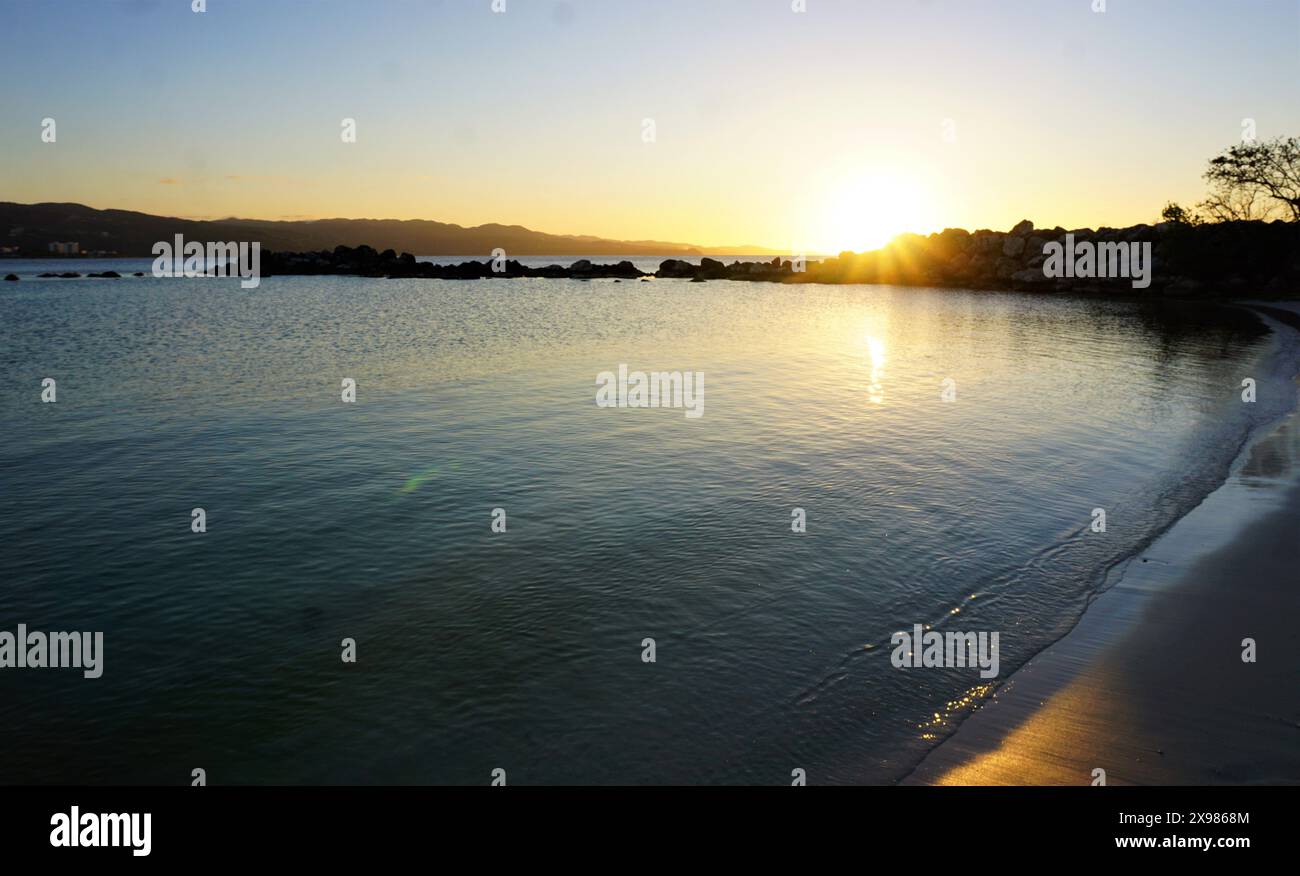 Jamaican beach at sunset Stock Photo - Alamy