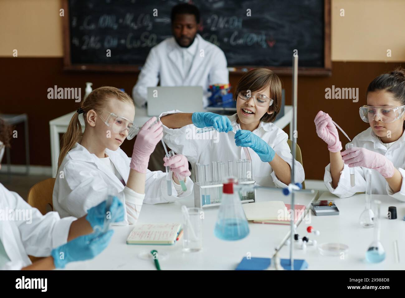 School kids on laptop in class hi-res stock photography and images - Alamy