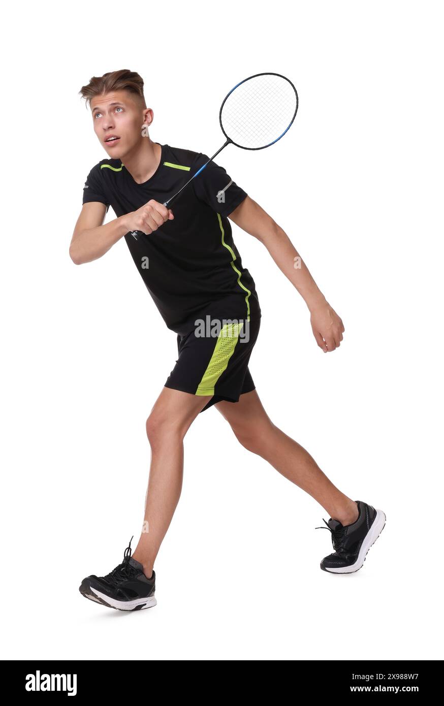 Young man playing badminton with racket on white background Stock Photo ...