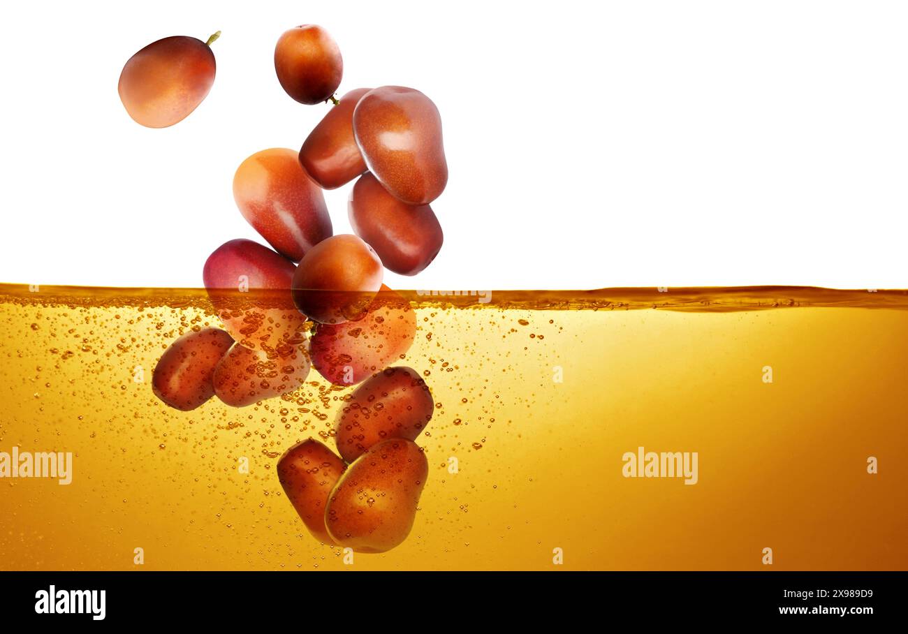Palm fruits falling into cooking oil on white background Stock Photo ...