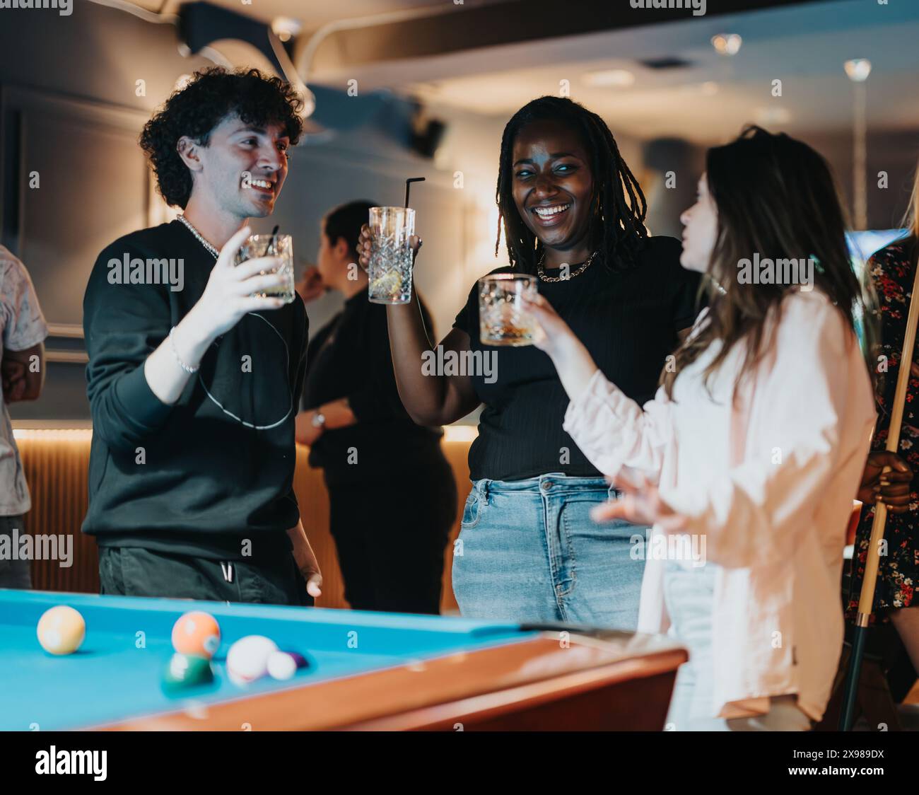 Happy diverse friends drinks playing hi-res stock photography and ...