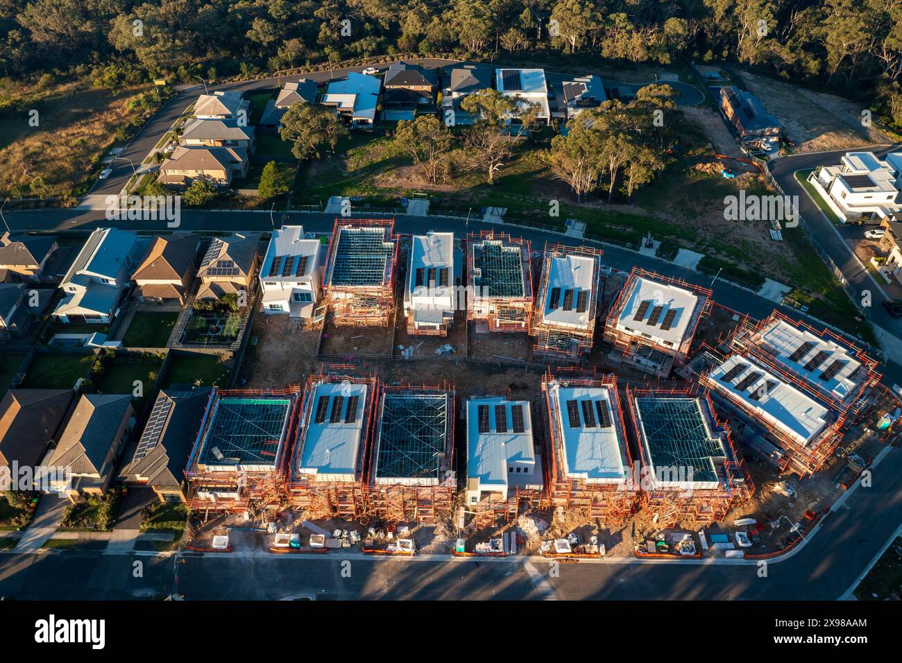 Late afternoon aerial view of modern Australian homes under ...