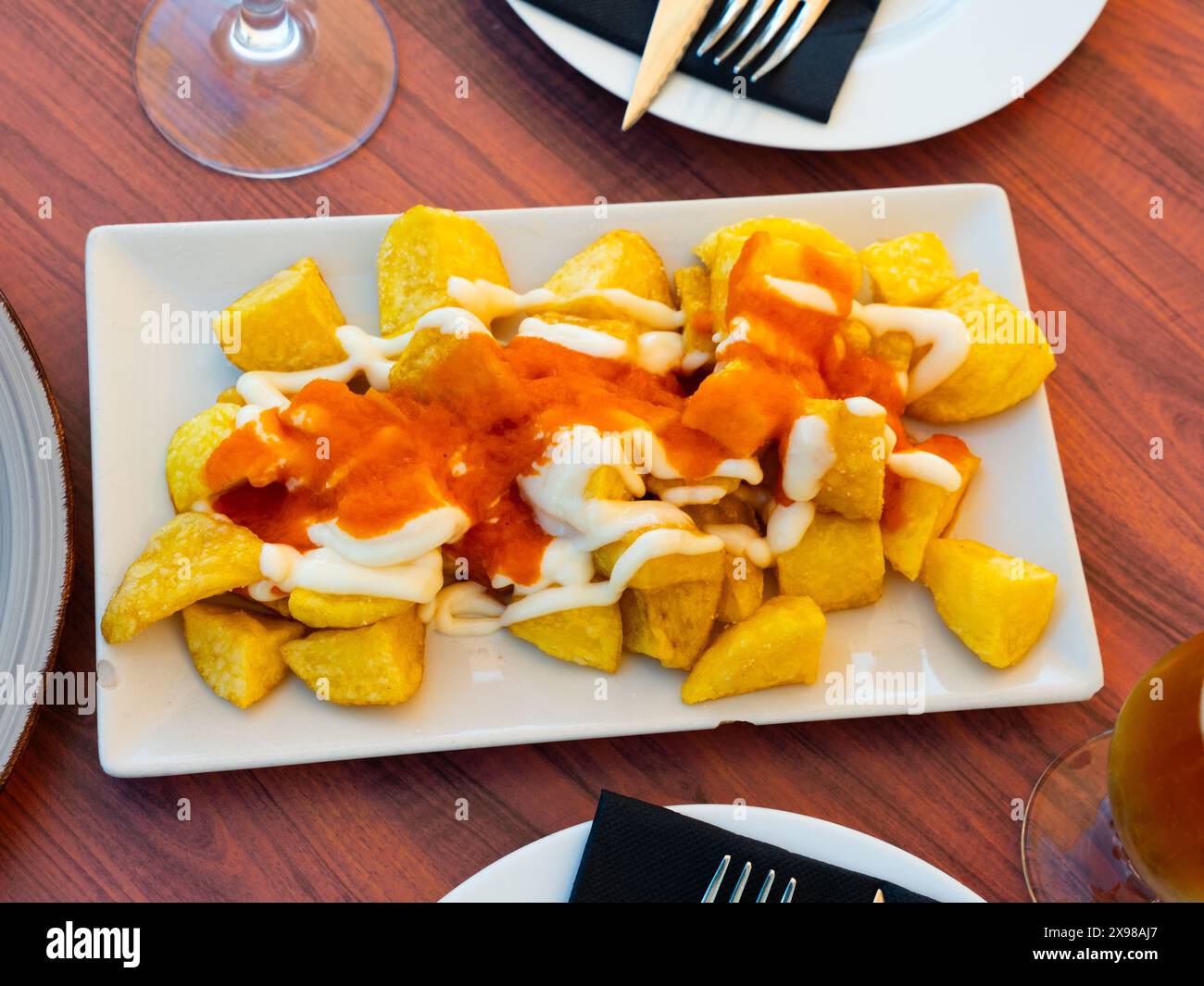 Main course in Spanish cafes and bars is potato tapas with mixture of ...