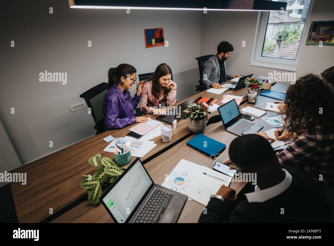 Multiracial team in a strategic meeting at an office workspace Stock ...