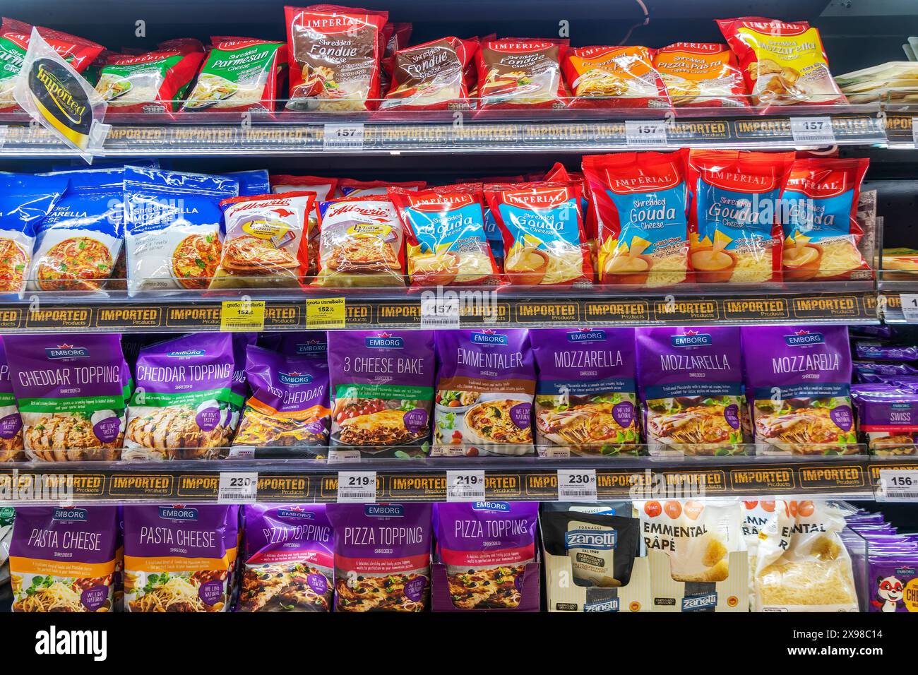 Packs of imported cheeses on a supermarket shelf in Thailand Stock ...