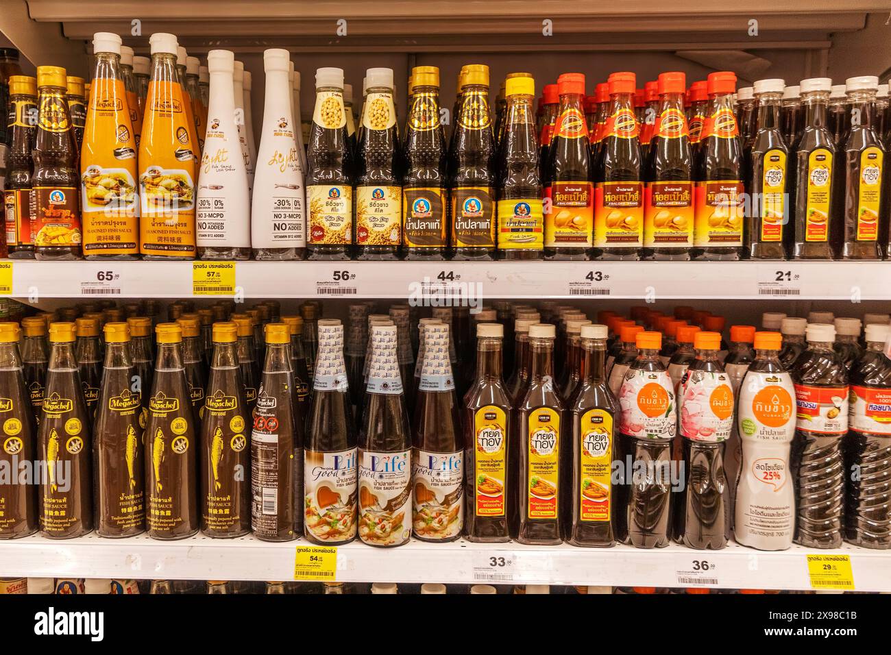 Various sauces displayed on a supermarket shelf in Thailand Stock Photo ...