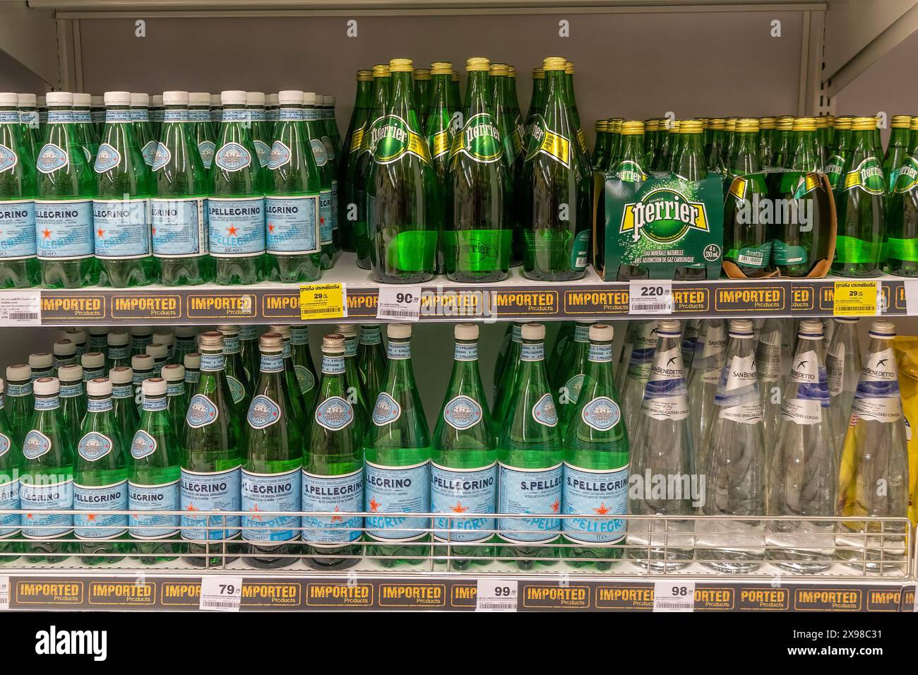 Bottles of imported mineral water on a supermarket shelf in Thailand ...