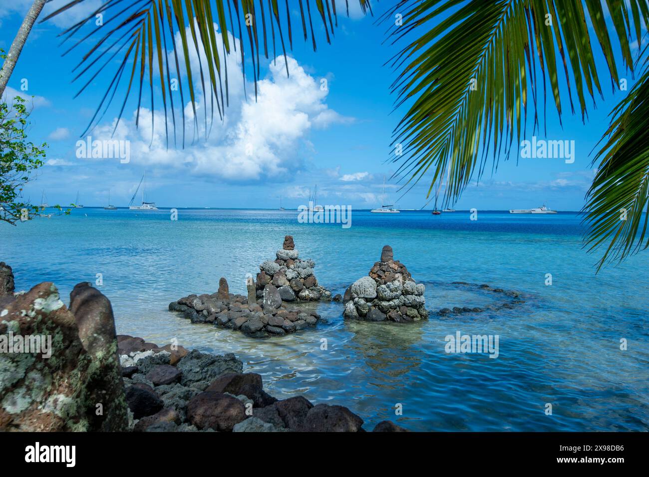 Stacked rocks on the island of Taha'a, French Polynesia Stock Photo - Alamy