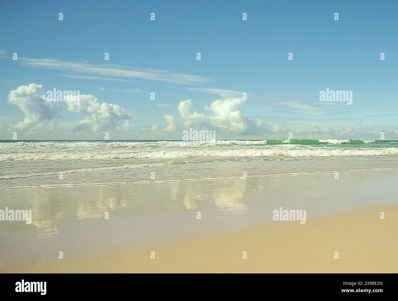 Surf waves break and roll onto sandy beach, Sunshine Coast, Queensland ...