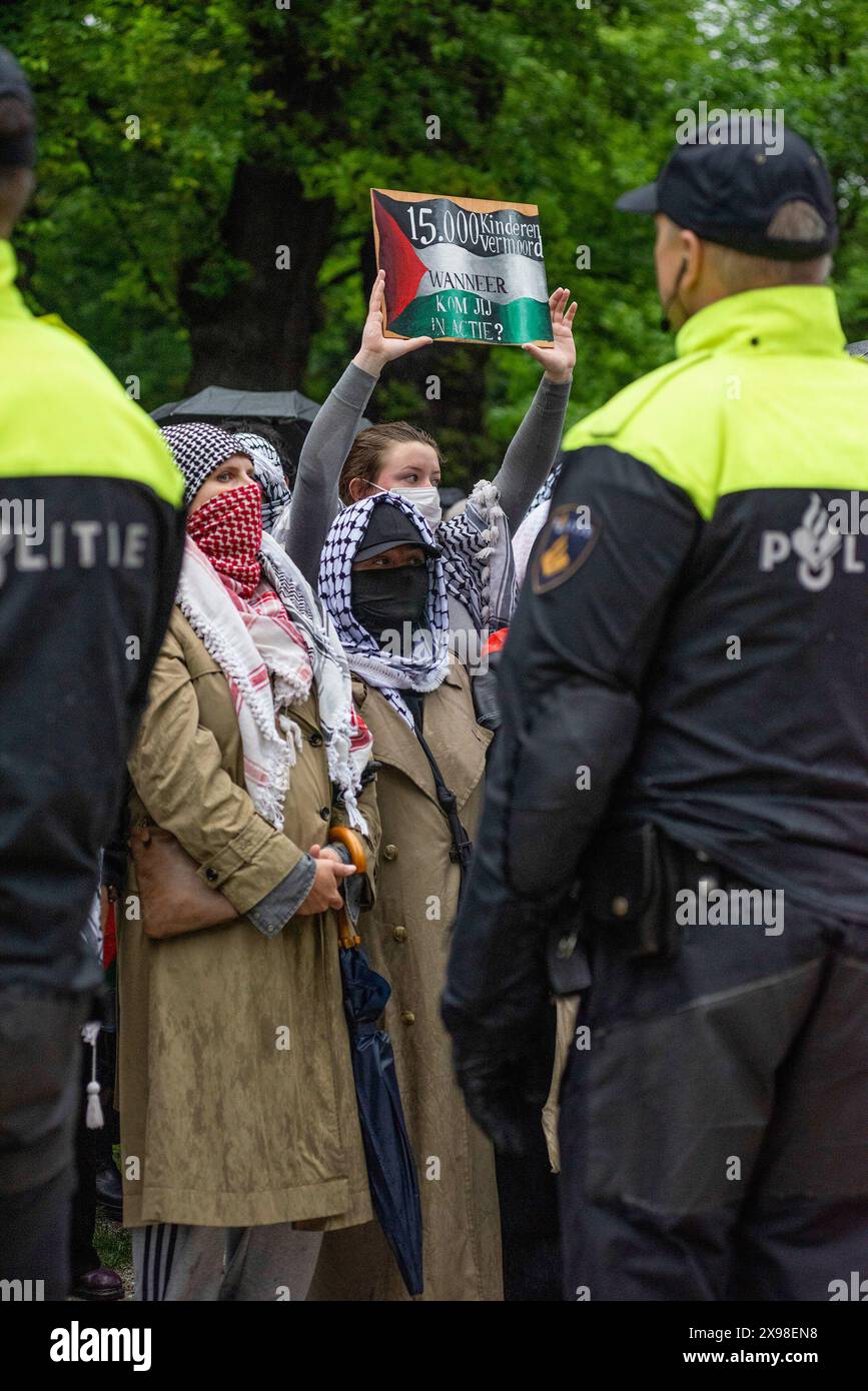 Pro-Palestinian female supporters holding a poster and expressing her ...