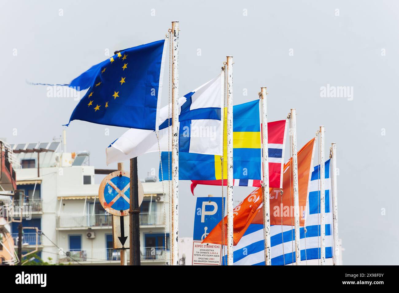 Various national flags in Agios Nikolaos in Crete Stock Photo - Alamy