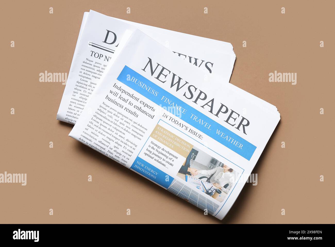 Different newspapers on brown background Stock Photo - Alamy