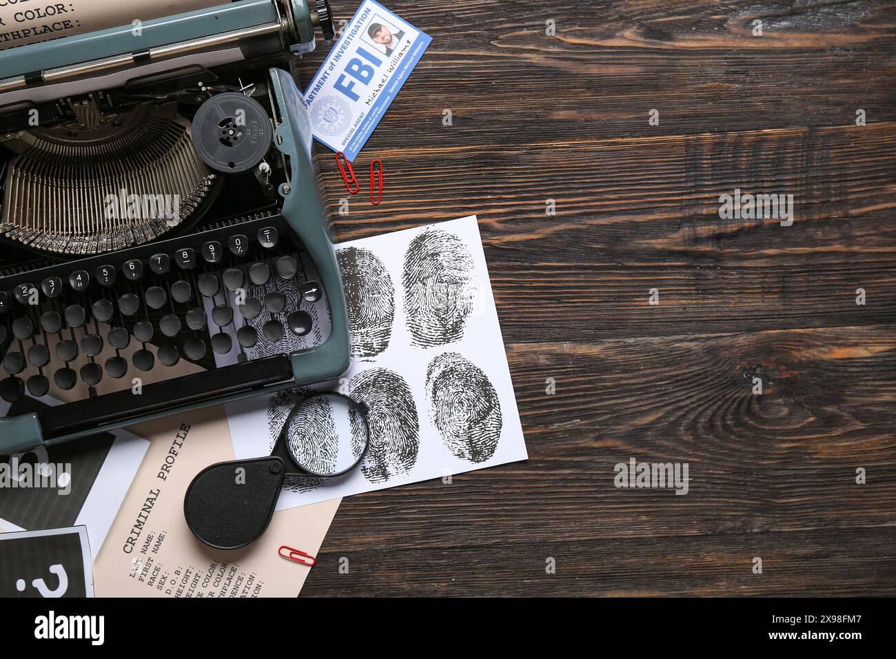 Retro typewriter, criminal files and document of FBI agent on dark ...