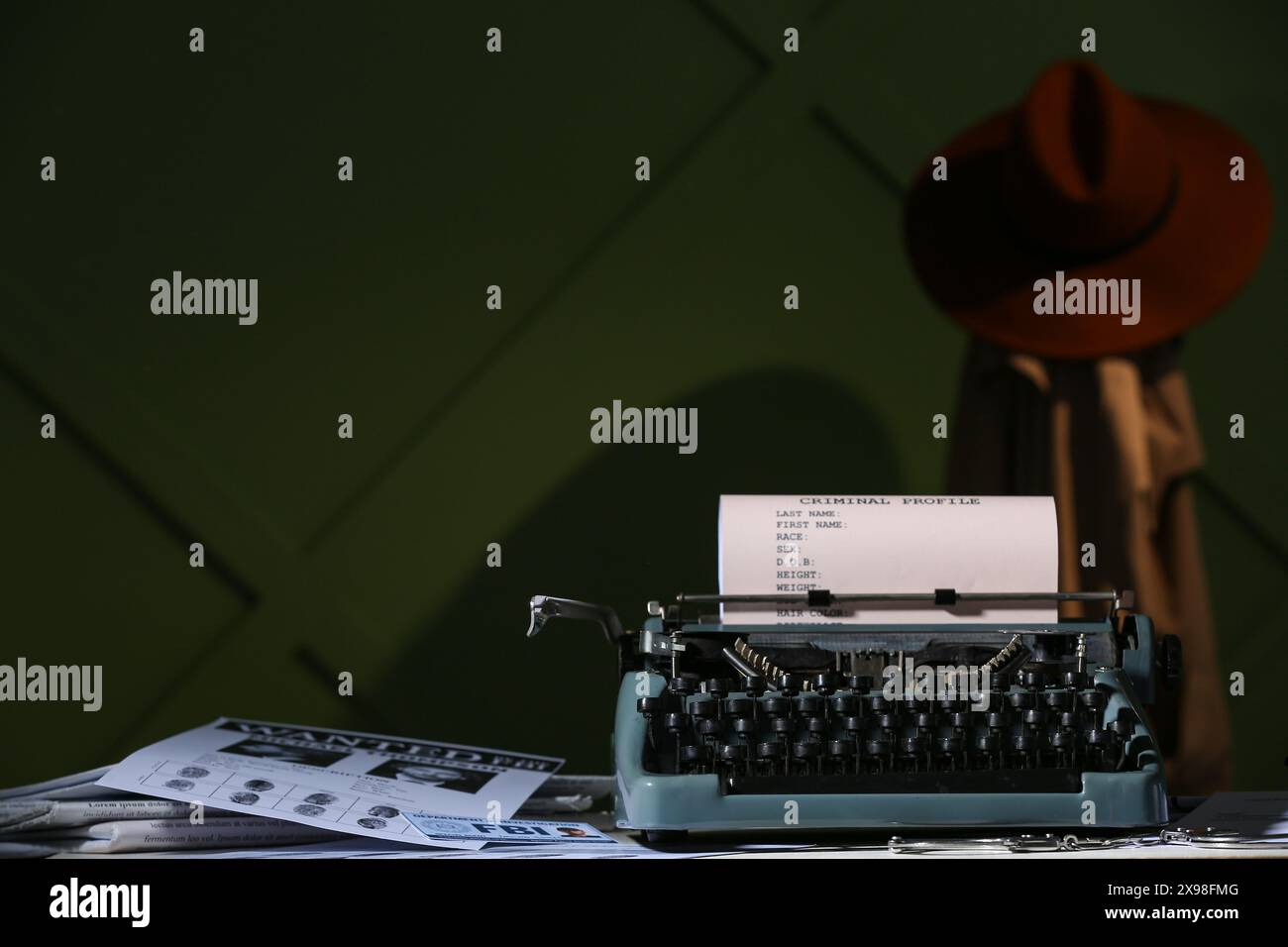 Retro typewriter, wanted poster, handcuffs and document of FBI agent on ...