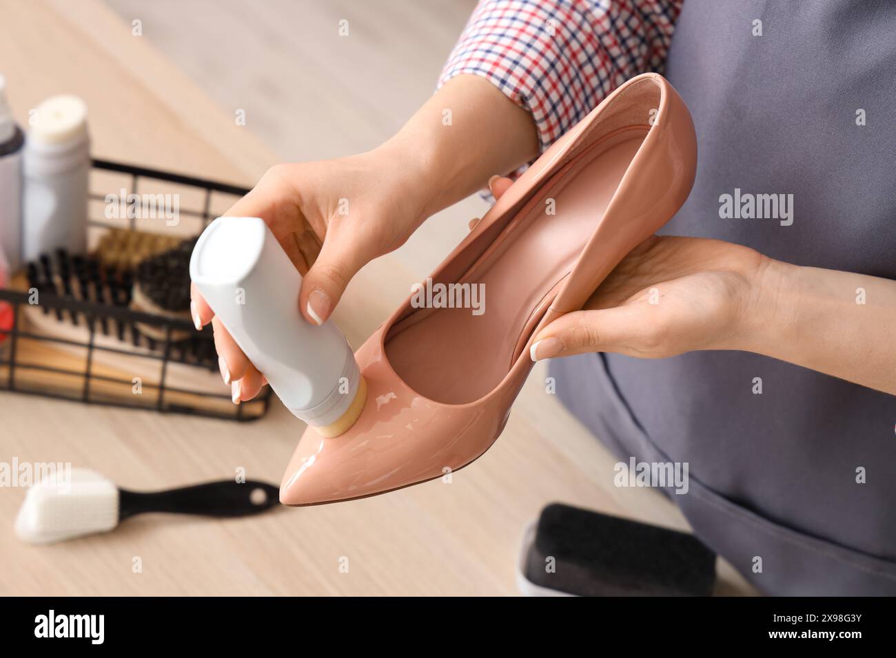 Female shoemaker polishing stylish high heel, closeup Stock Photo - Alamy