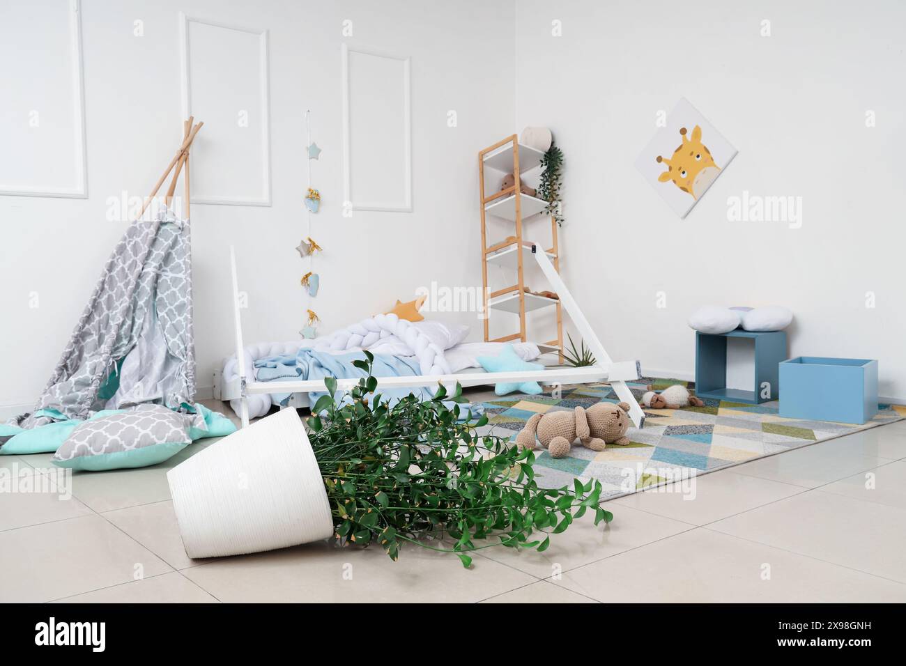 Overturned plant on floor in messy children's room Stock Photo - Alamy