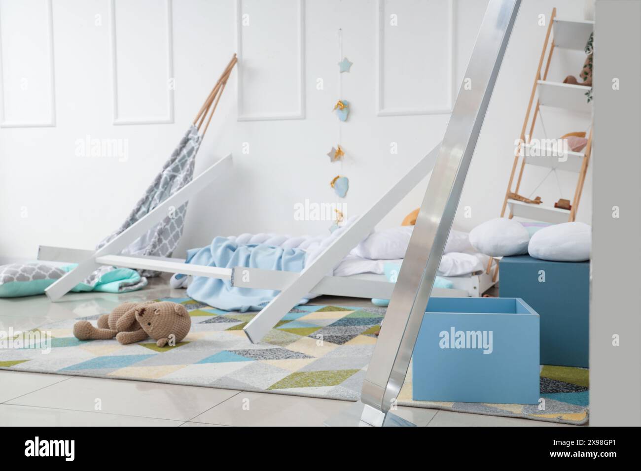 Broken bed with overturned lamp in messy children's room Stock Photo ...
