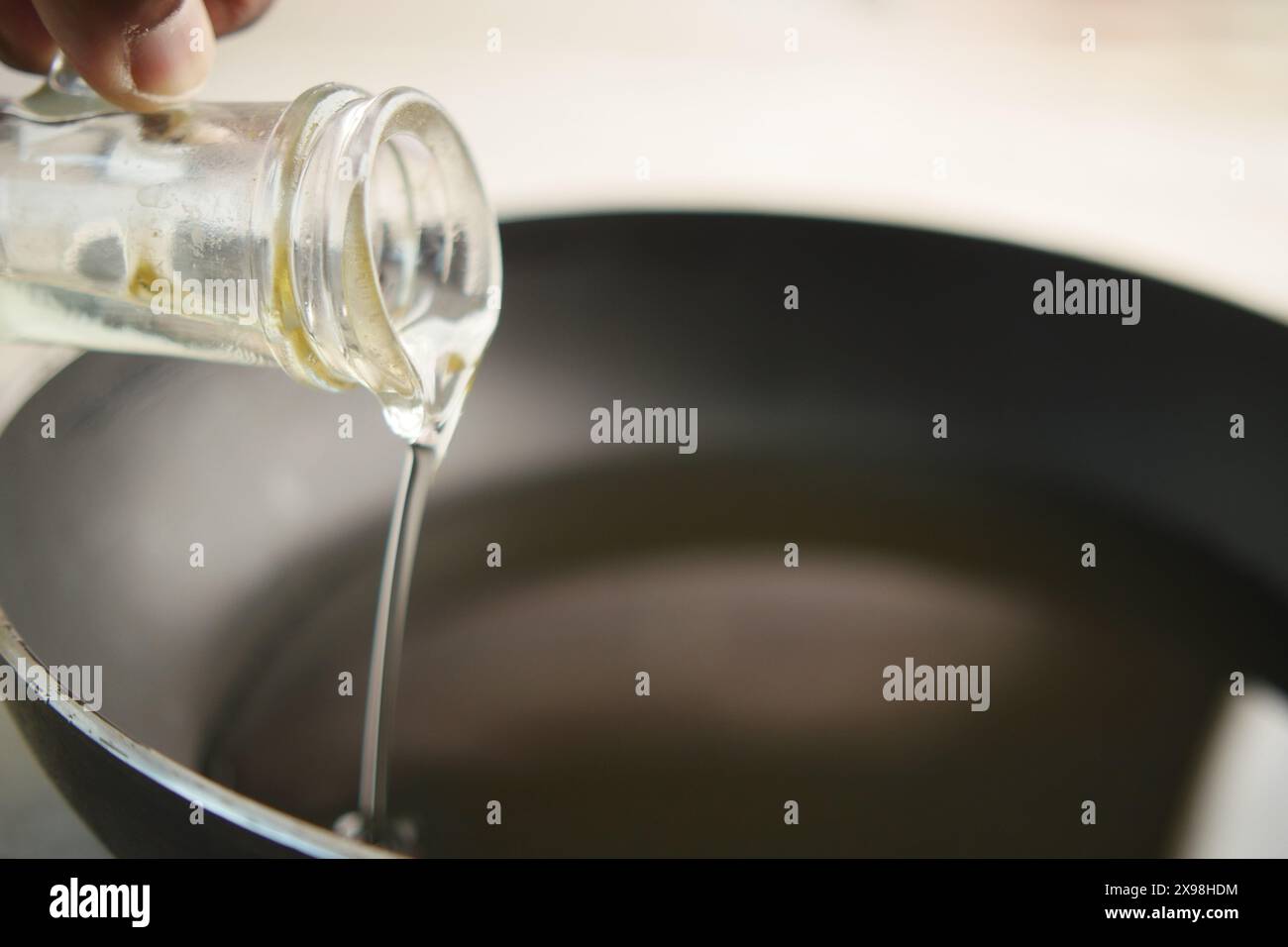 Chef hands pouring olive oil hi-res stock photography and images - Alamy