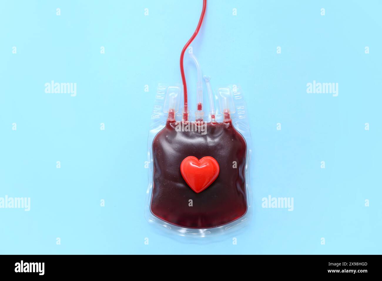 Blood pack with heart on blue background. World Blood Donor Day Stock ...